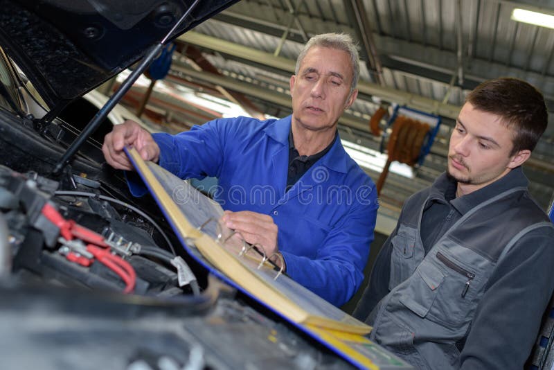 Male Mechanics Working on Car Engine Stock Image - Image of repairman ...