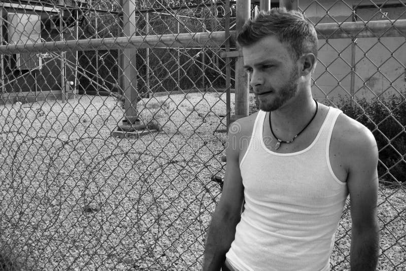 Male Model on Chainlink and Wire Stock Image - Image of look, rock: 1159967