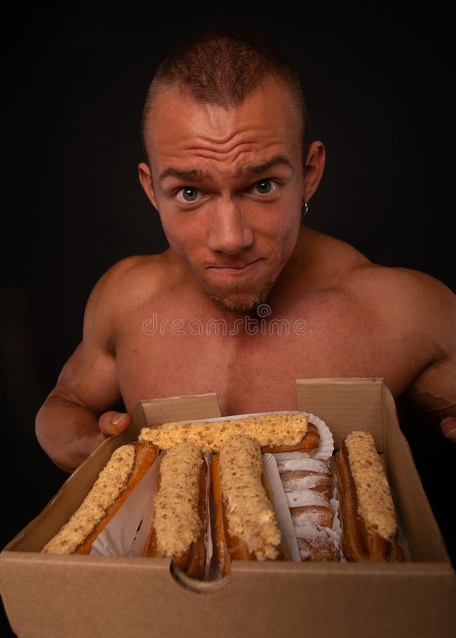 Male model with eclair stock image. Image of eclair - 179984363