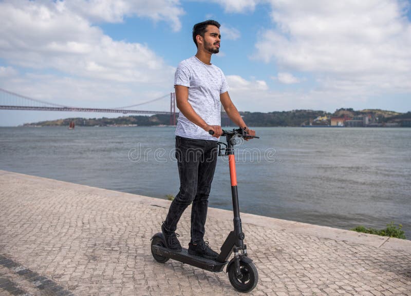Male Model in Font of River with Scooter Stock Photo - Image of urban ...