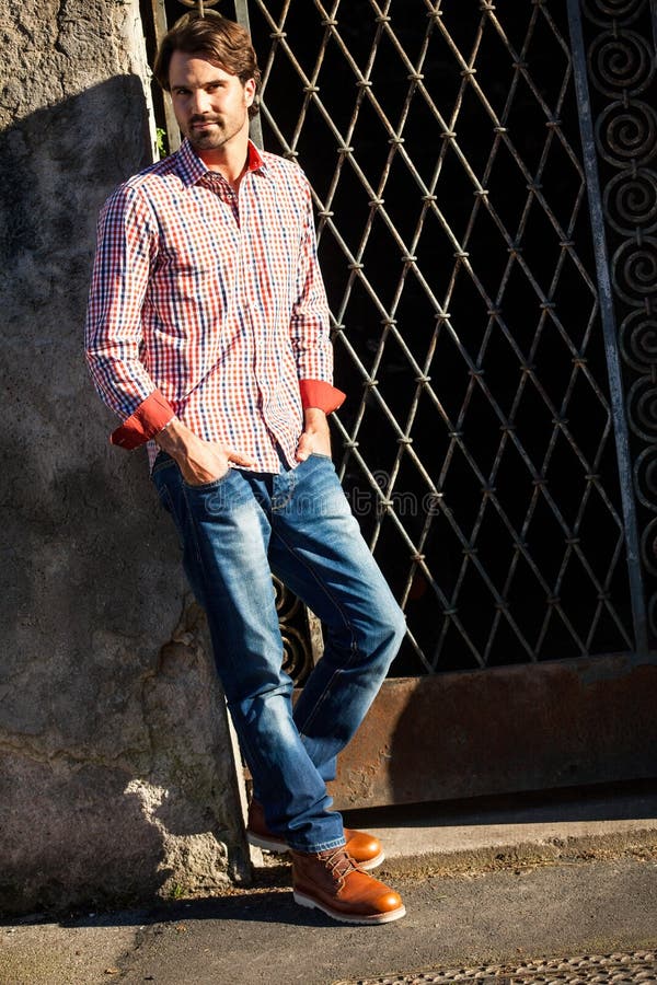 Male Model Leaning Against Wall Stock Photo - Image of thoughtful, mesh ...