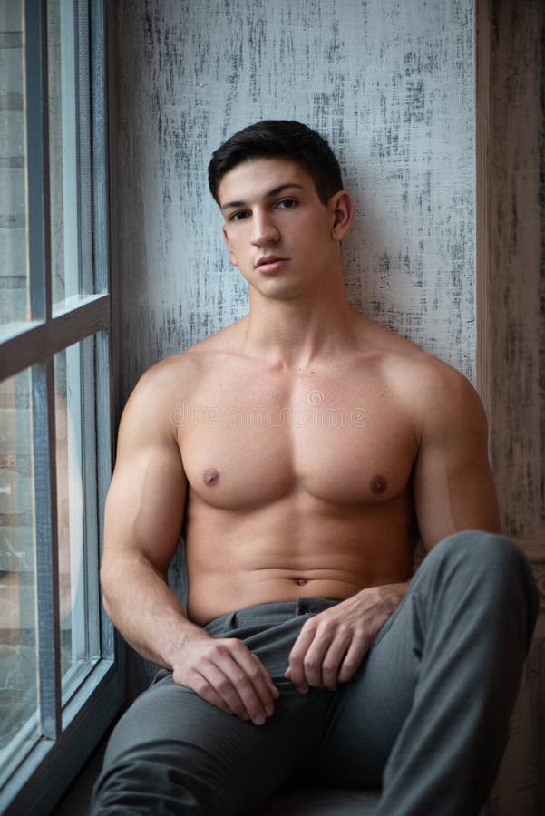 Male model on the rocks stock image. Image of strength - 16409745