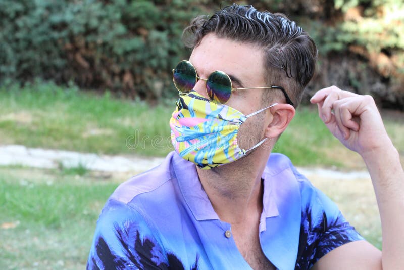 Male Model Posing with Floral Protective Mask Stock Photo - Image of ...