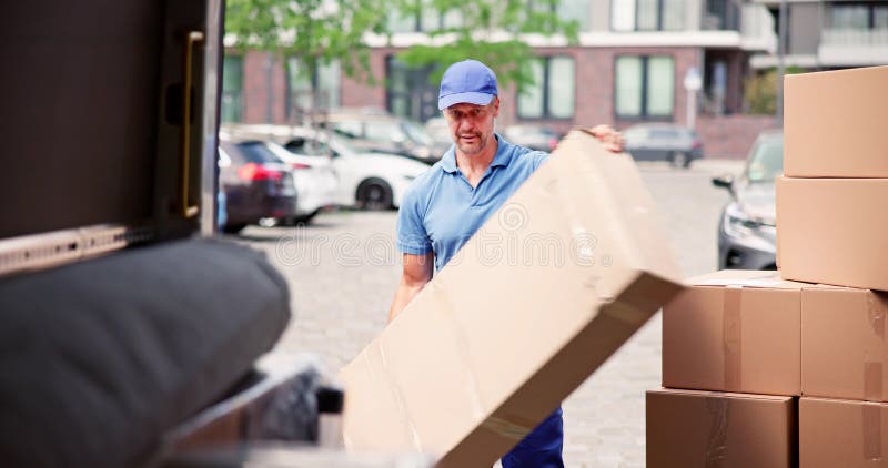 Male Movers in Uniform Loading Delivery Stock Image - Image of delivery ...