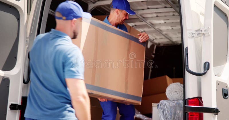 Delivery Men Loading Cardboard Boxes Stock Image - Image of deliver ...