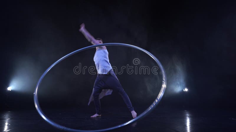 Male Muscular Acrobat Shows Difficult Tricks for a Balance and ...