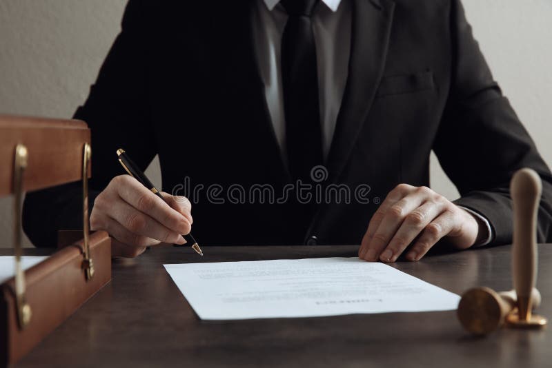 Notary Signing a Contract with Fountain Pen in Dark Room Stock Photo ...