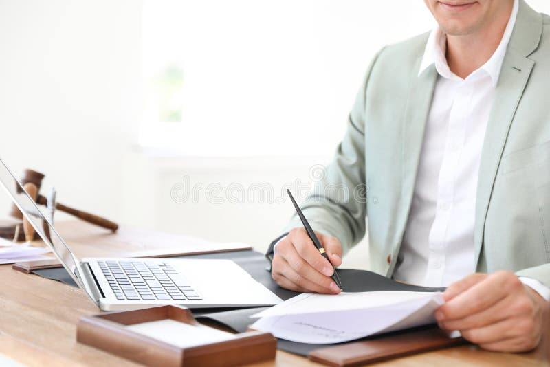 Male Notary Signing Document at Table in Office Stock Photo - Image of ...