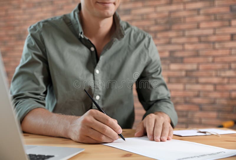 Male Notary Signing Document at Table in Offic Stock Photo - Image of ...
