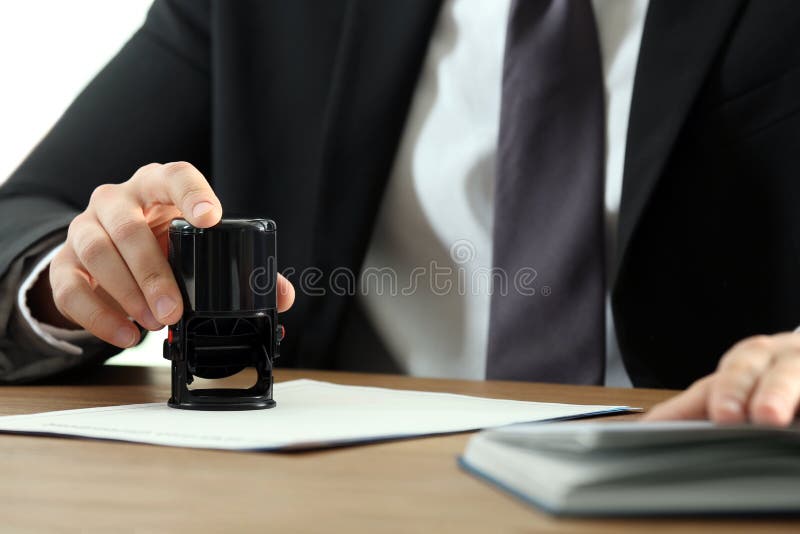 Male Notary Stamping Document at Table Stock Photo - Image of adult ...