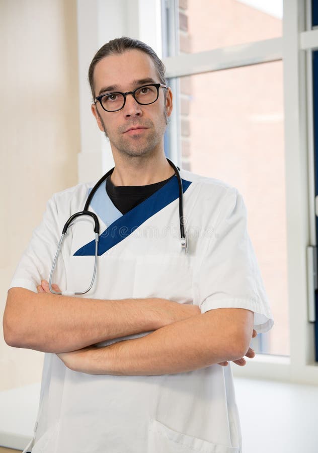 Portrait of Male Nurse Working at Nurses Station Stock Image - Image of ...