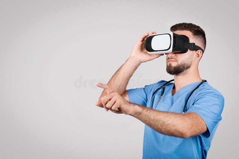 Male Nurse in Scrubs Using VR Headset for Training Stock Image - Image ...