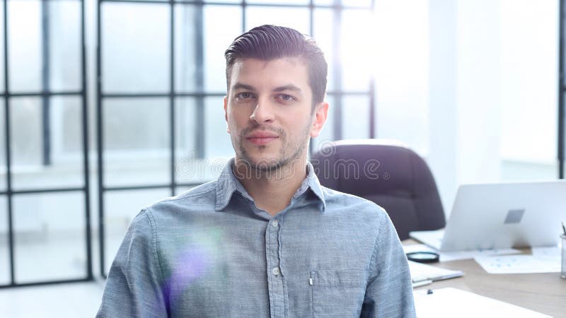 A Male Office Worker Looks at the Camera in Close-up Stock Photo ...
