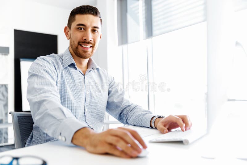 Male Office Worker Sitting at Desk Stock Image - Image of attractive ...