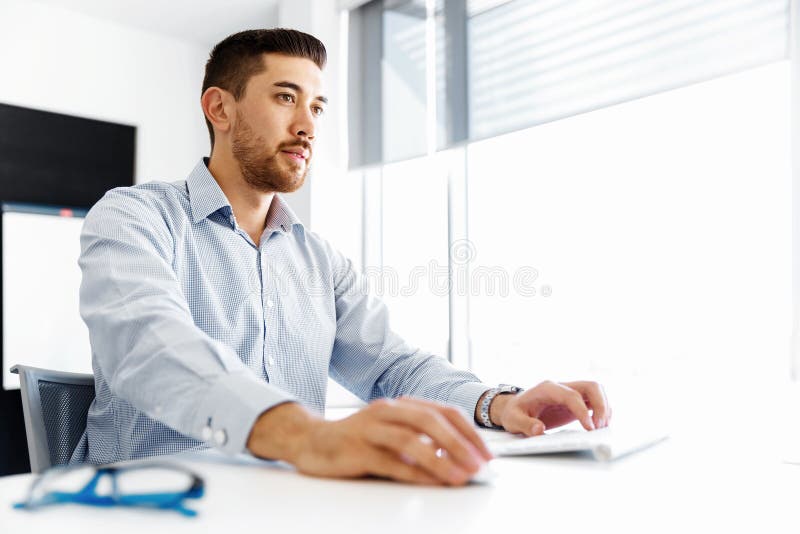 Male Office Worker Sitting at Desk Stock Photo - Image of break ...