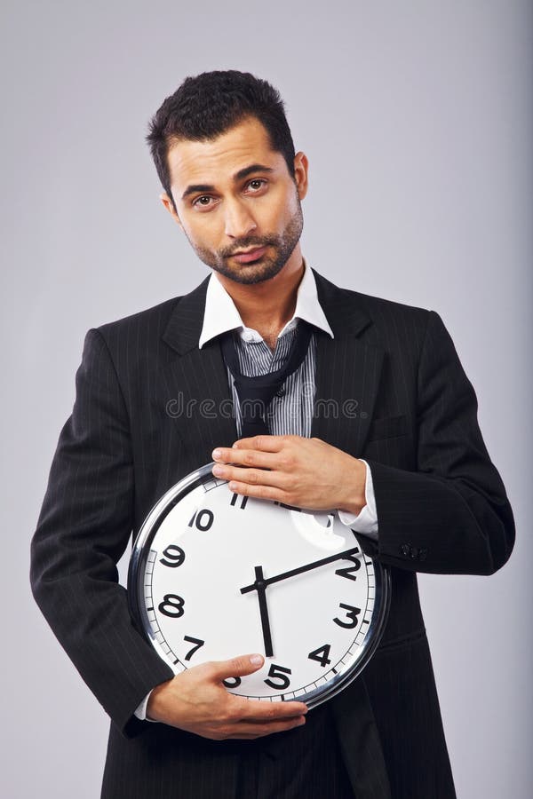Male Office Worker with a Wall Clock Stock Photo - Image of businessman ...