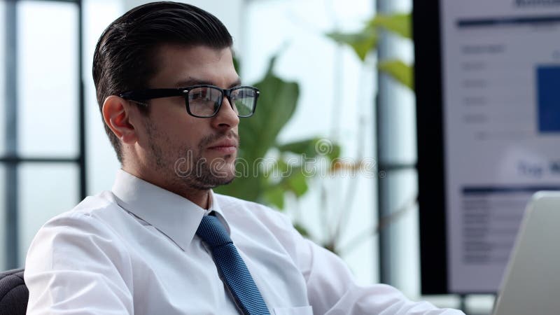 A Male Office Worker is Working on a Laptop Stock Photo - Image of ...