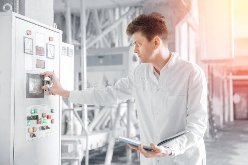 Male Operator Engineer Performs Process Production Line from Control ...