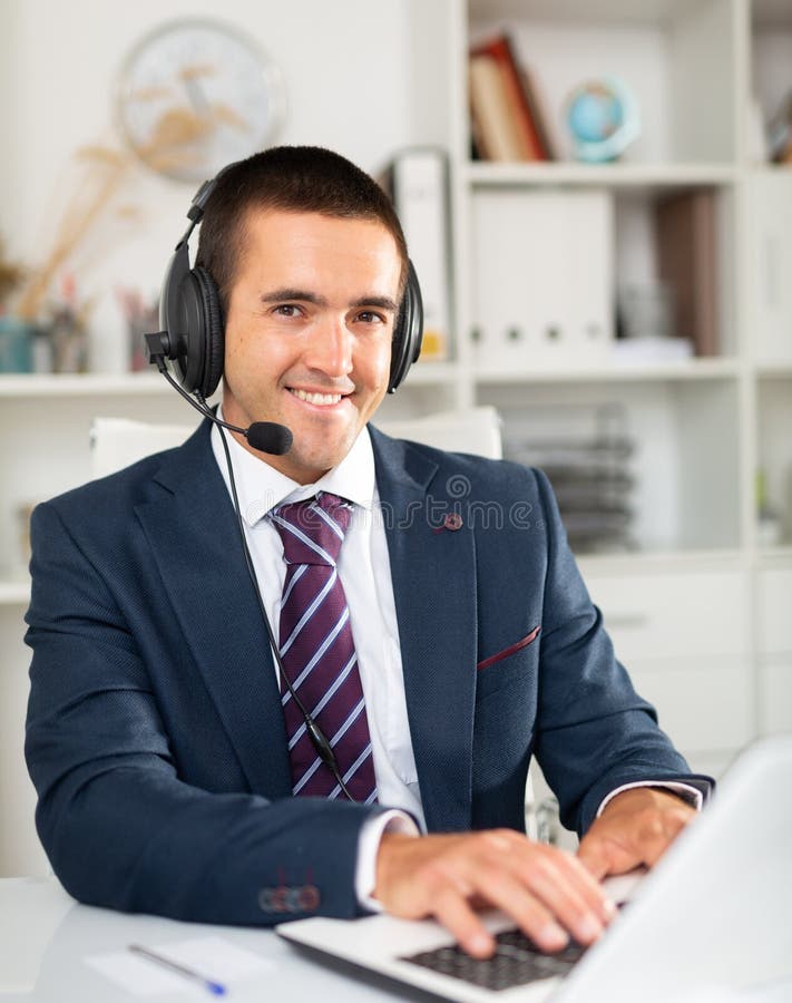 Male Operator Talking with Customer Using Headset at Office Stock Image ...