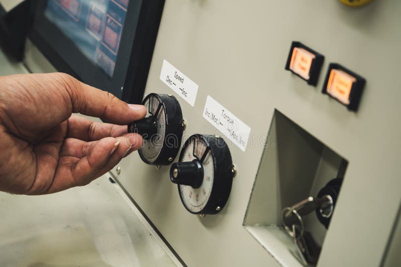 Male Operator Use Left Hand To Tuning Roller Speed Level To Start the ...