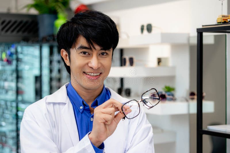 Male Optician Standing with a Eyeglasses in Optical Store Stock Image ...