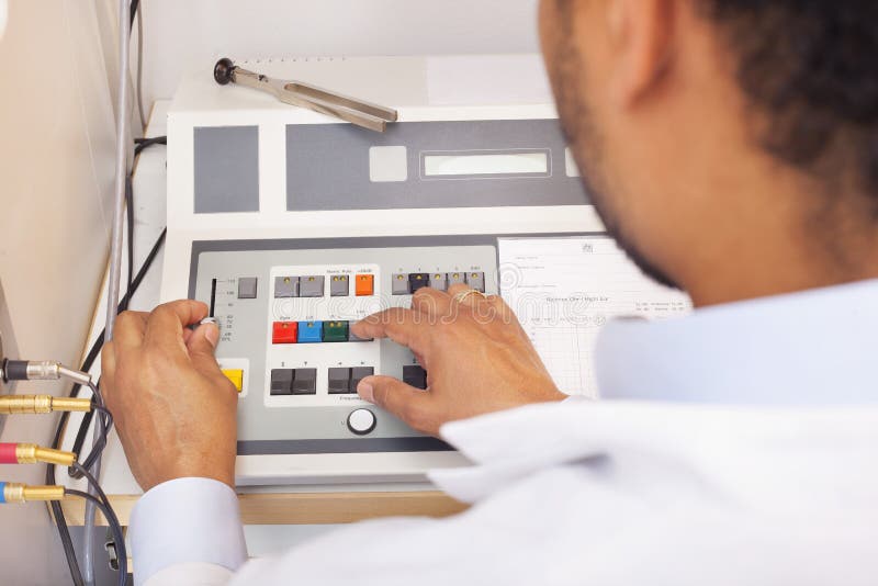 Male Otolaryngologist on Hearing Test Machine Stock Image - Image of ...