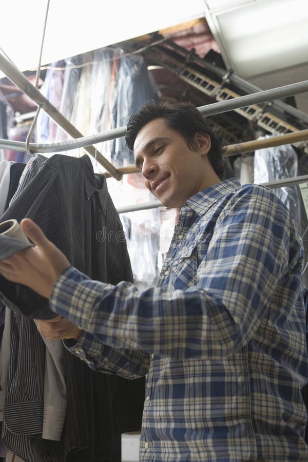 Male Owner Checking Clothes in Laundry Stock Image - Image of owner ...