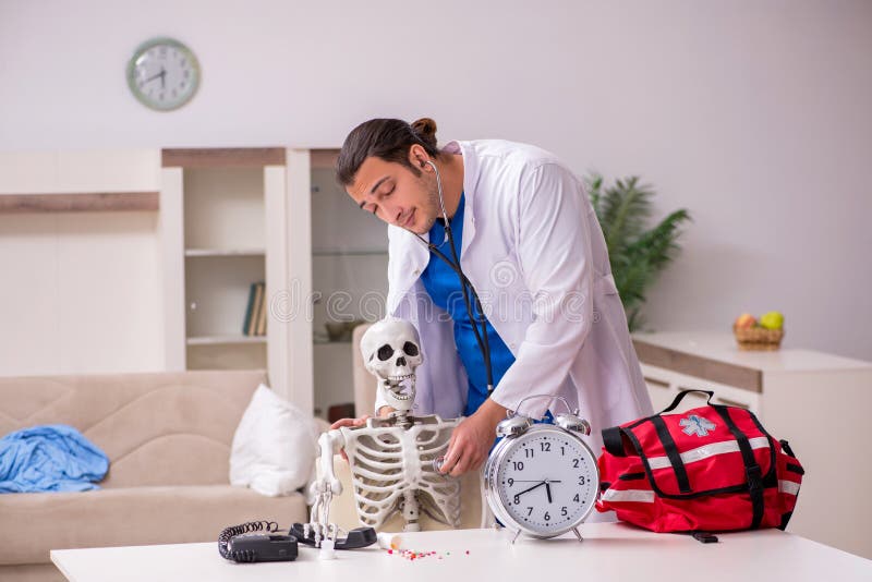 Young Male Paramedic Visiting Skeleton Patient Stock Photo - Image of ...