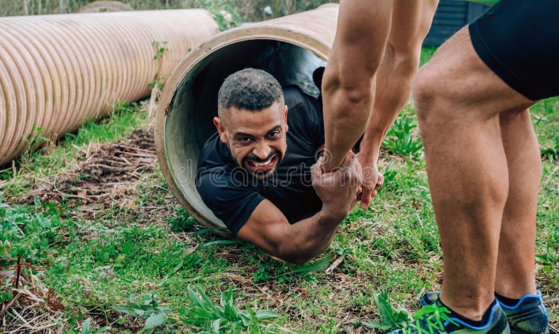 Participants Obstacle Course Going through a Pipe Stock Image - Image ...