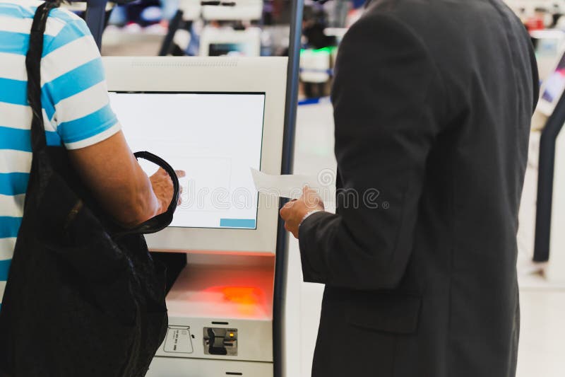 Male Passenger with Backpack Doing Self Check in for Flight at ...
