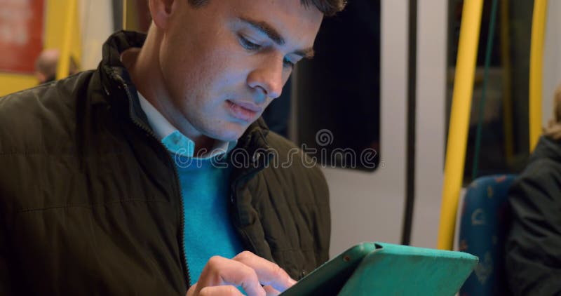 Male Passenger with Touch Pad in Subway Train Stock Image - Image of ...