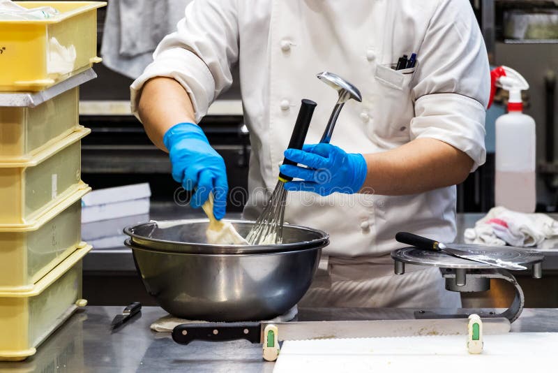 A Male Pastry Chef Using a Spatula and a Whisk while Making Whipped ...