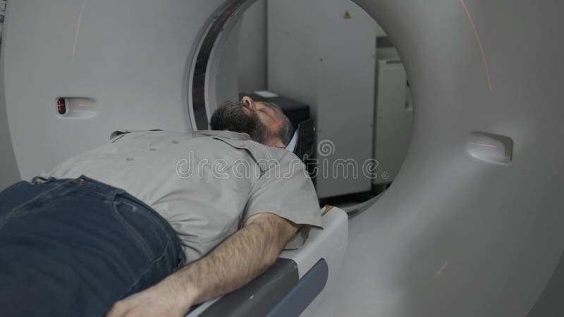 Male Patient on the Ct or Mri Scanner Machine during X-Ray Process ...
