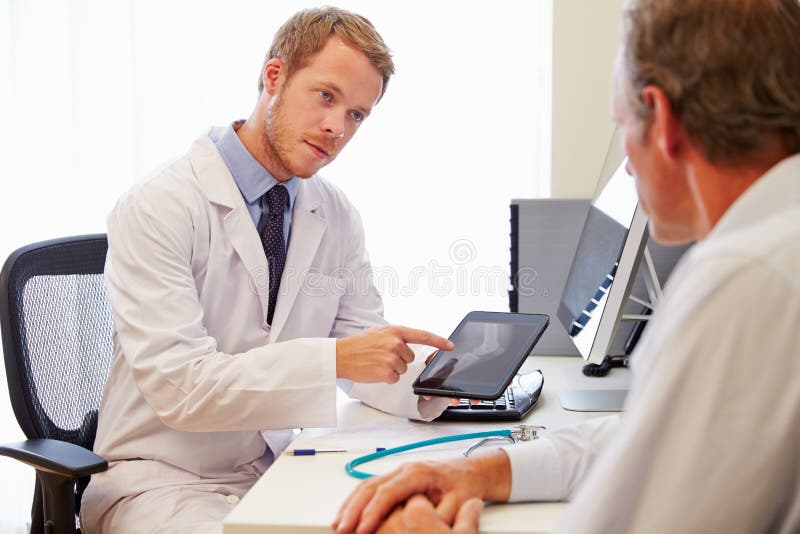 Male Patient Having Consultation with Doctor in Office Stock Photo ...