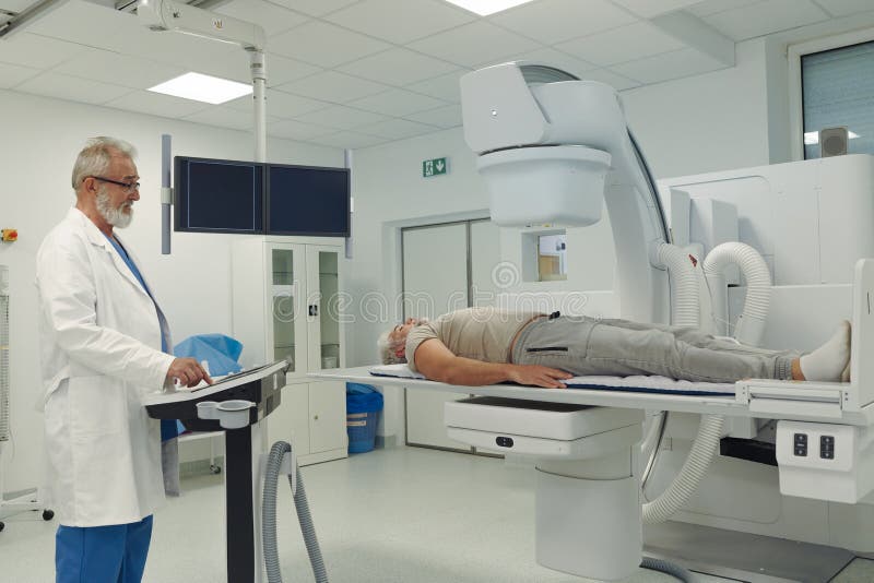 Male Patient Undergoing X-ray Examination Using Tilting Radiographic ...