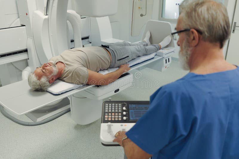 Male Patient Undergoing X-ray Examination Using Tilting Radiographic ...