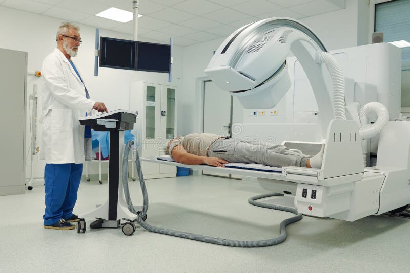 Male Patient Undergoing Ray Examination Using Tilting Radiographic Wall ...