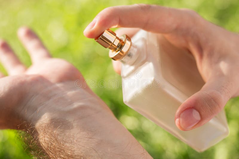 Man using perfume stock photo. Image of hold, beauty - 60642762