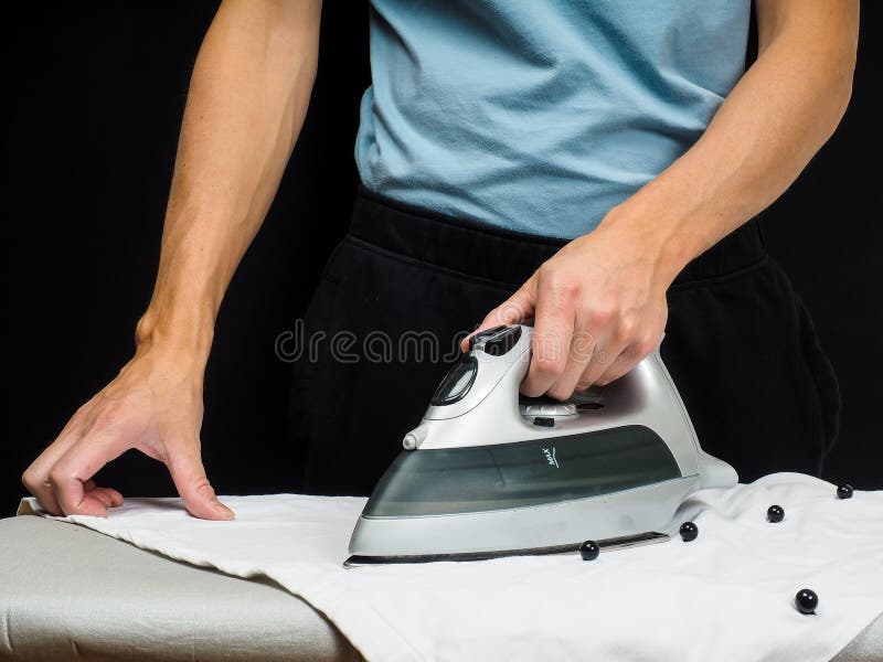 Male Person Using a Steaming Hot Iron Stock Image - Image of cloth ...