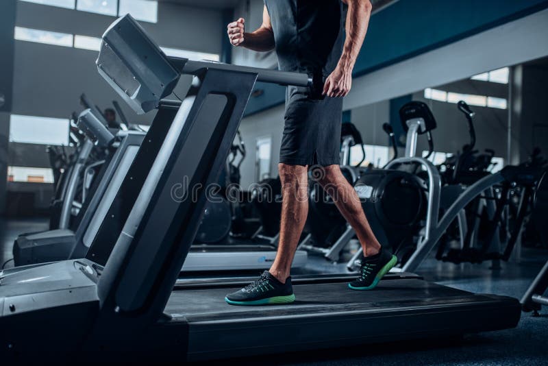 Male Person Workout on Running Exercise Machine Stock Photo - Image of ...