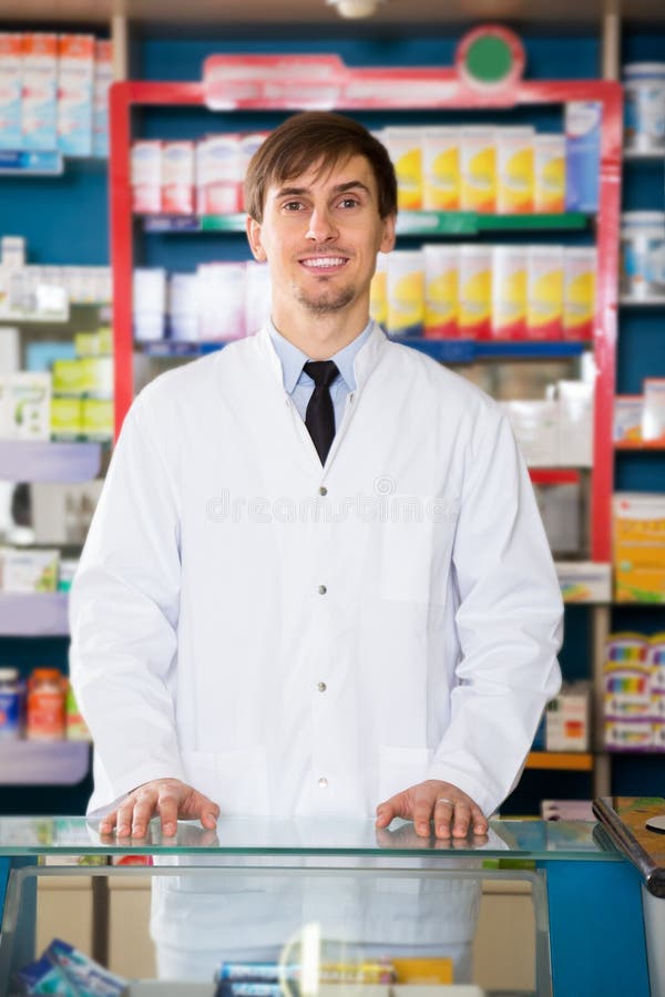 Male Pharmacist Posing in Drugstore Stock Photo - Image of indoor ...