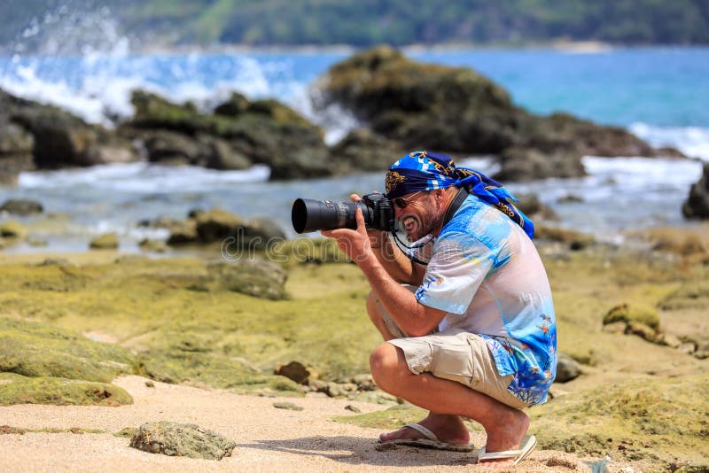 Male Photographer with DSLR Camera on the Beach Stock Photo - Image of ...