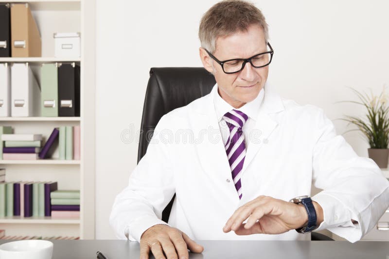 Doctor Looking at His Watch Stock Image - Image of white, looking: 47213087