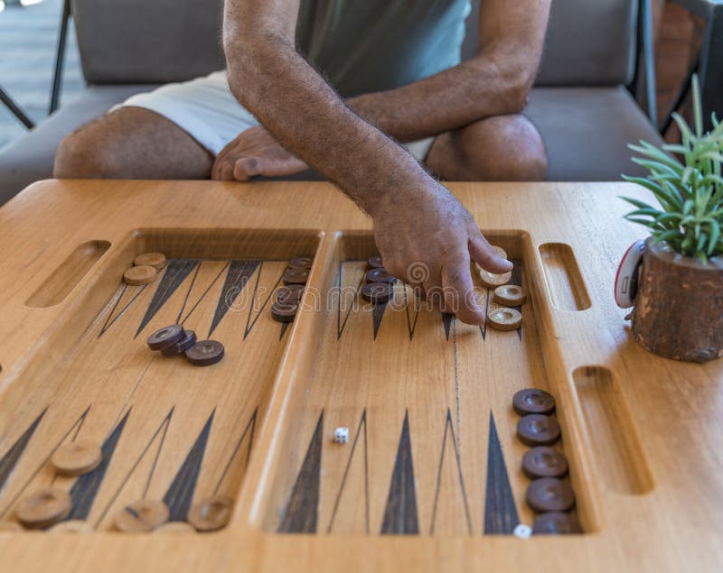 Male Playing a Traditional Oriental Board Game of Backgammon. Men`s ...