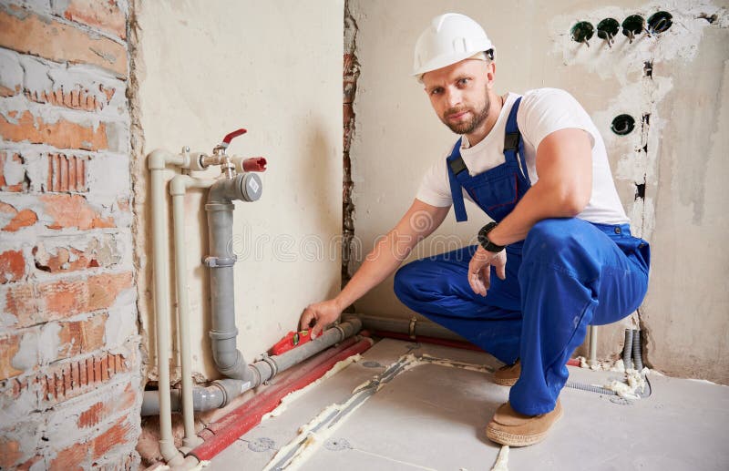 Man Checking Plumbing Pipe with Spirit Level Tool in Apartment. Stock ...