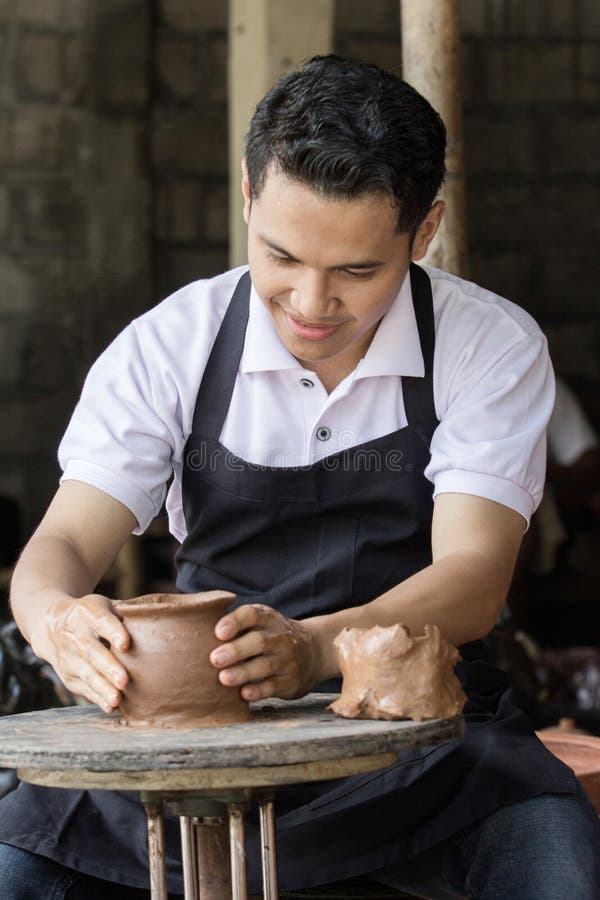 Male potter making pot stock photo. Image of professional - 82707248