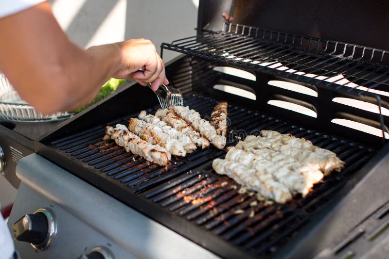 The Male Prepares a Barbecue in the Open Air. Stock Image - Image of ...