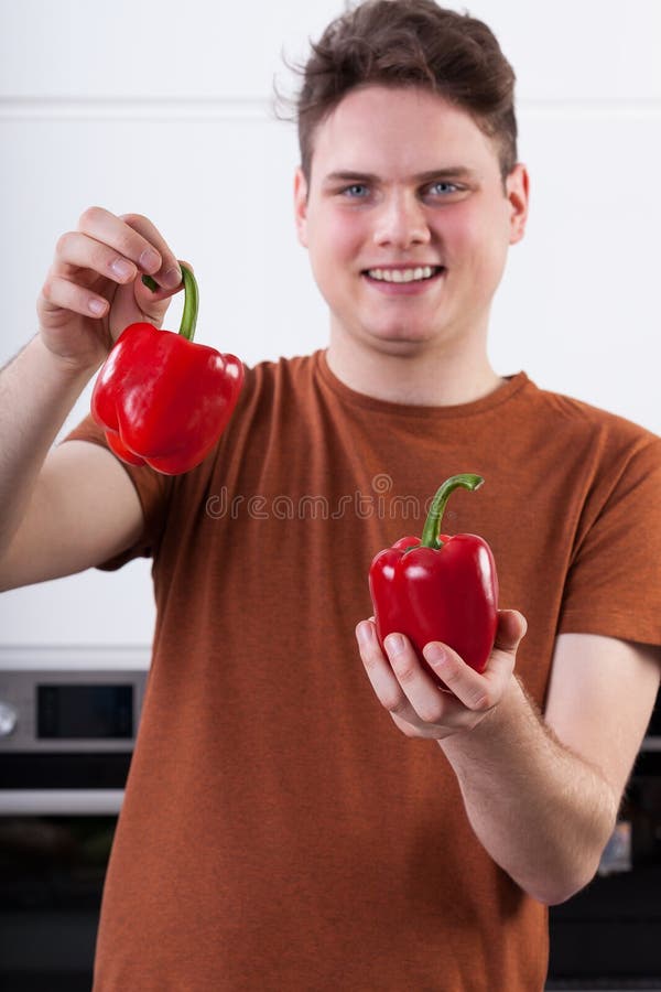 Male Presenting Two Red Peppers Stock Image - Image of nutrition ...