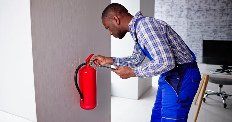 Male Professional Checking a Fire Stock Photo - Image of extinguisher ...