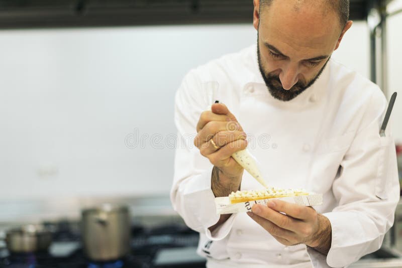 Male Professional Chef Cooking in a Kitchen. Stock Photo - Image of ...